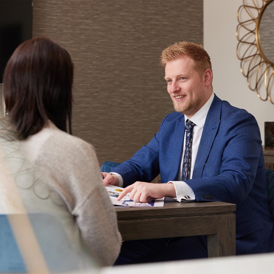 Estate Agent talking to Client